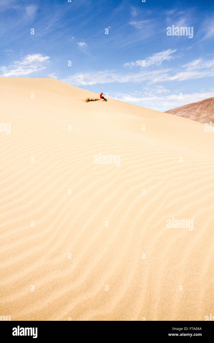 Sandboarding on the dunes of Alto los Verdes, in Atacama Desert ...