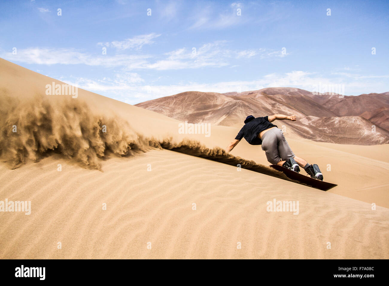Sandboarding on the dunes of Alto los Verdes, in Atacama Desert ...