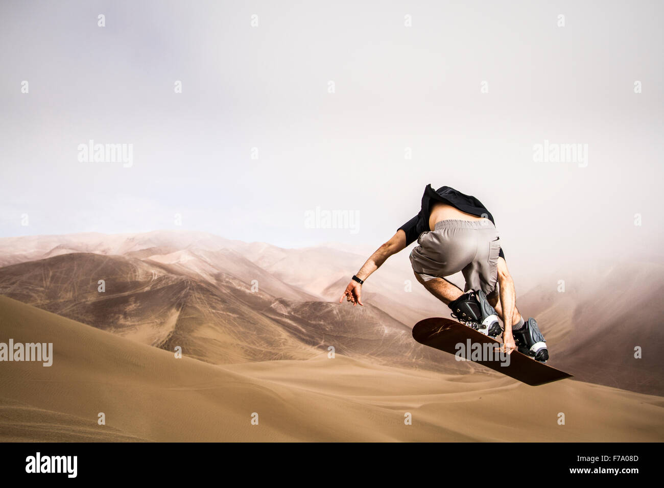 Sandboarding on the dunes of Alto los Verdes, in Atacama Desert ...
