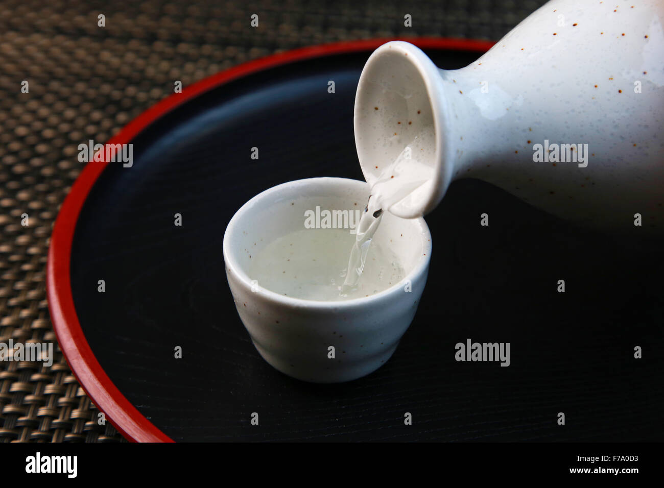 Japanese Sake pouring Stock Photo - Alamy