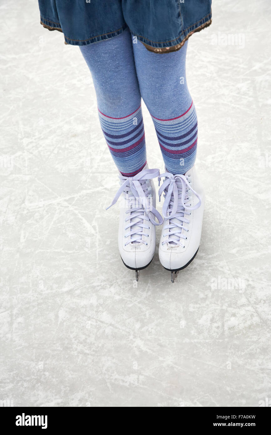 girl ice skating. child winter outdoors on ice rink. ice and legs Stock ...
