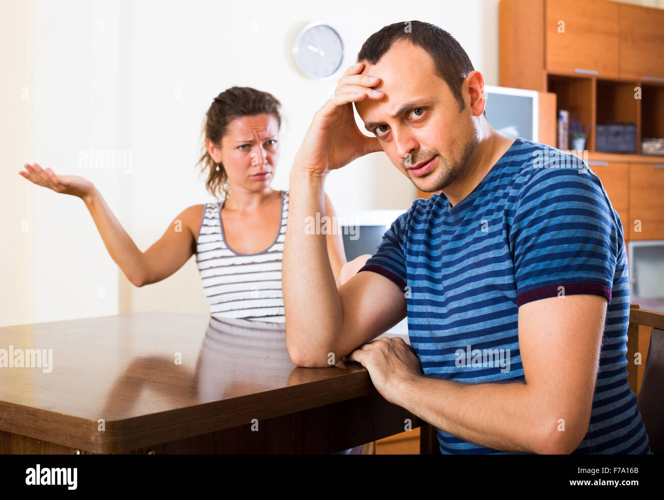 Serious home conflict in young family Stock Photo - Alamy