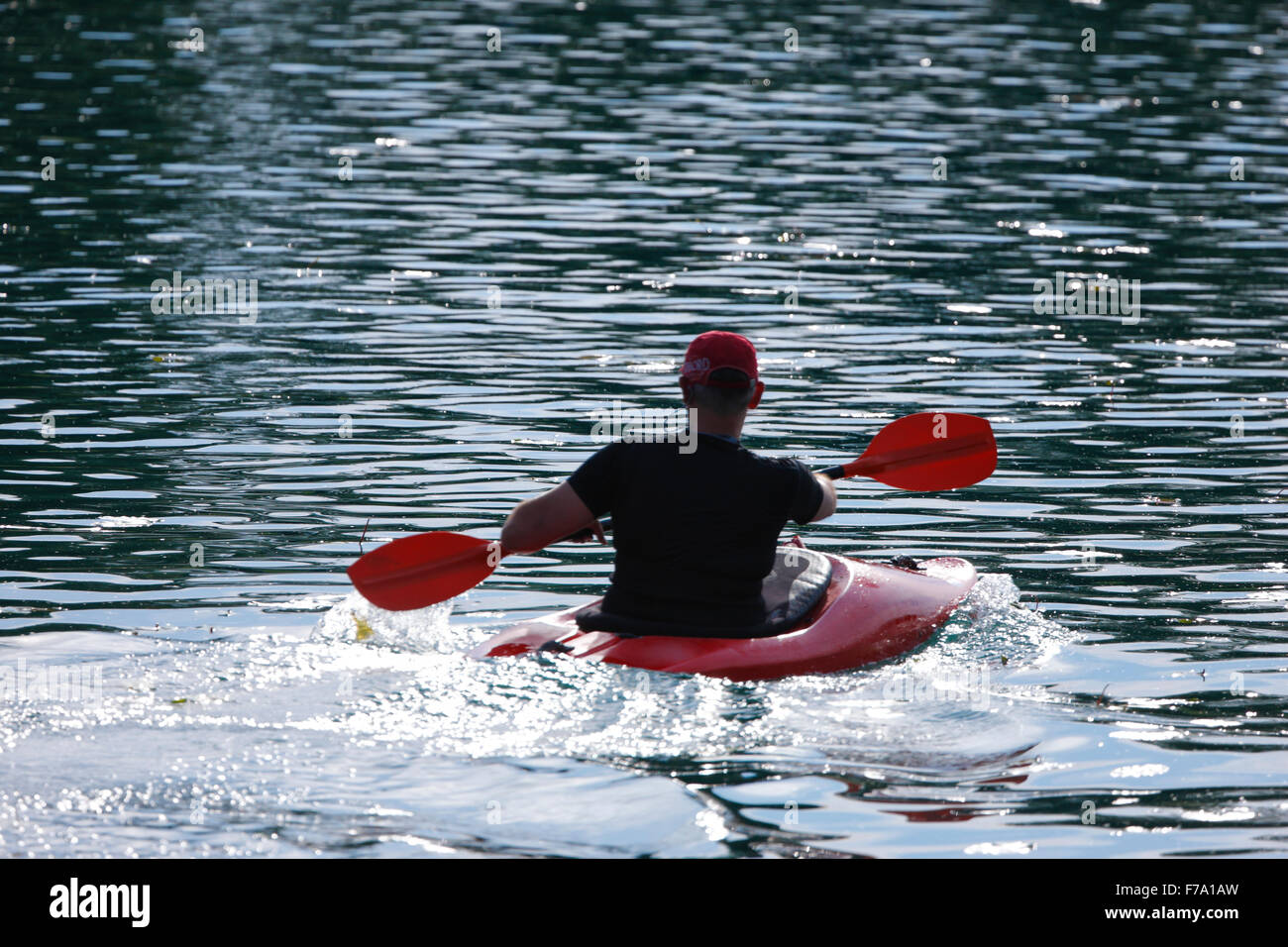 Man paddling kayak Stock Photo - Alamy