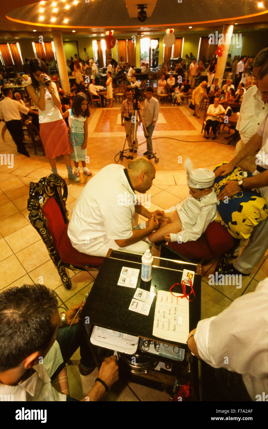 A young boy is circumcised at Kemal Özkan's Circumcision Palace in ...