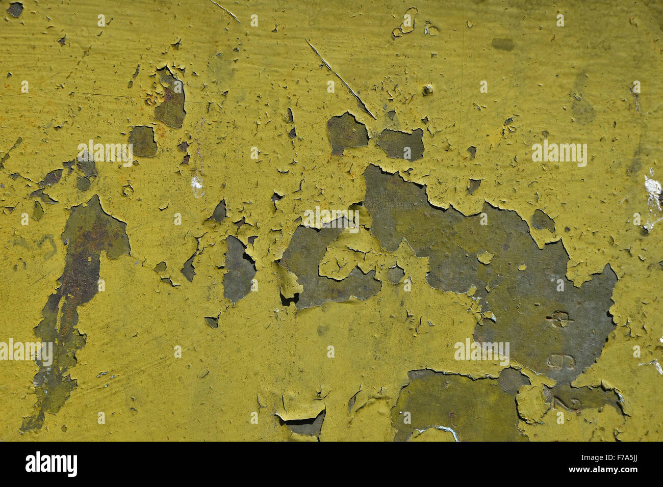 Stained corroded rusty yellow khaki painted metal surface with flakes ...