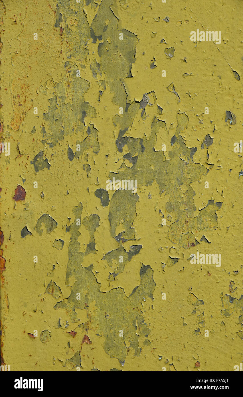 Stained corroded rusty yellow khaki painted metal surface with flakes ...