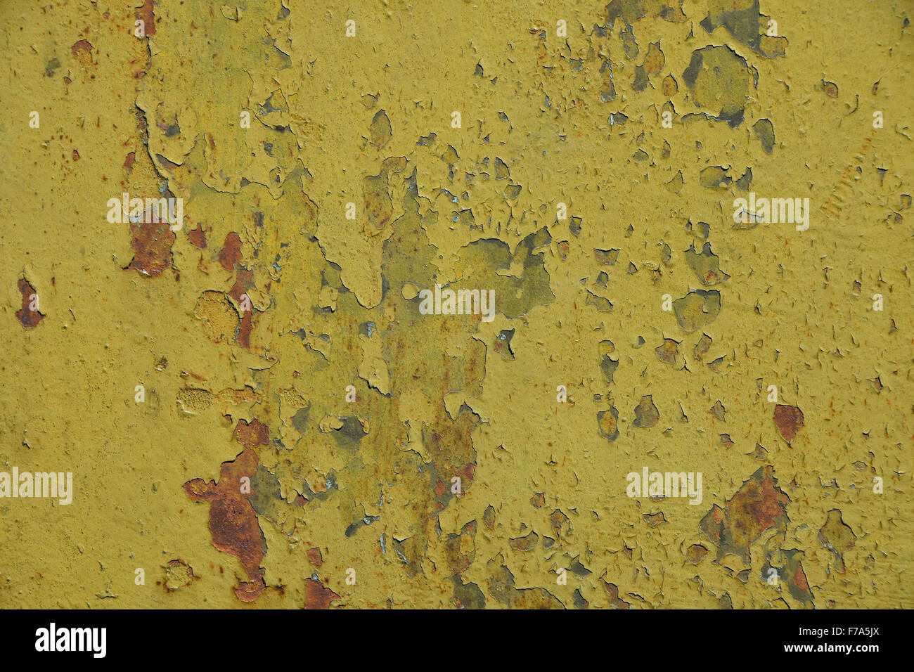 Stained corroded rusty yellow khaki painted metal surface with flakes ...