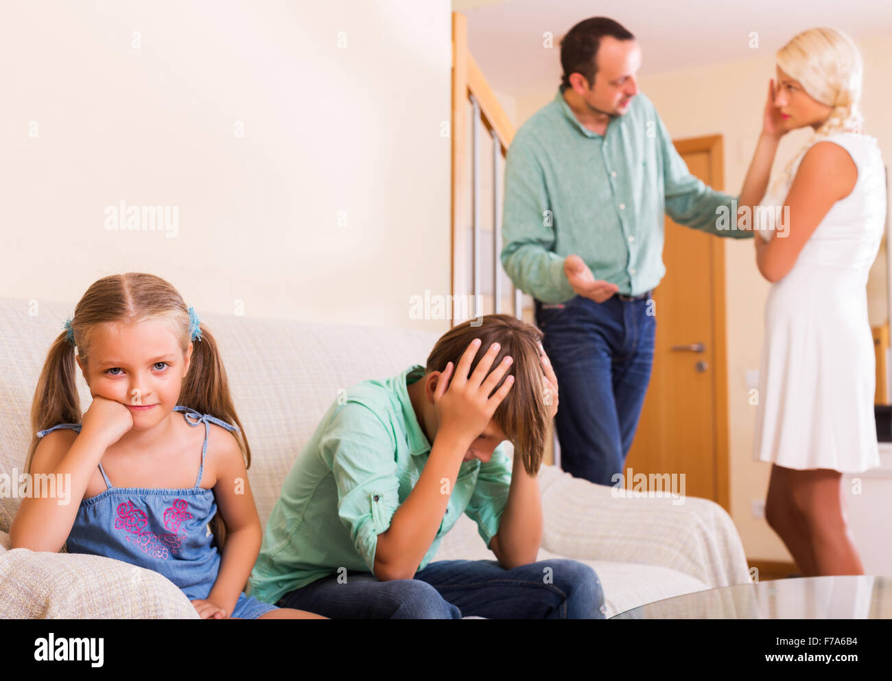 Unhappy siblings waiting when parents stop screaming ta home Stock ...