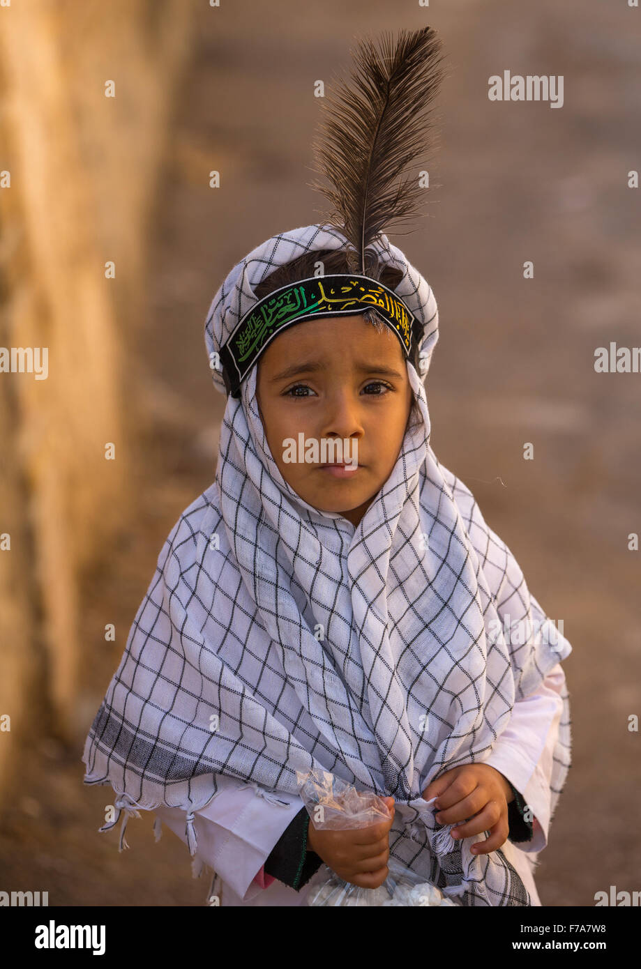 An Iranian Shiite Boy With A Feather On The Head During Tasua ...
