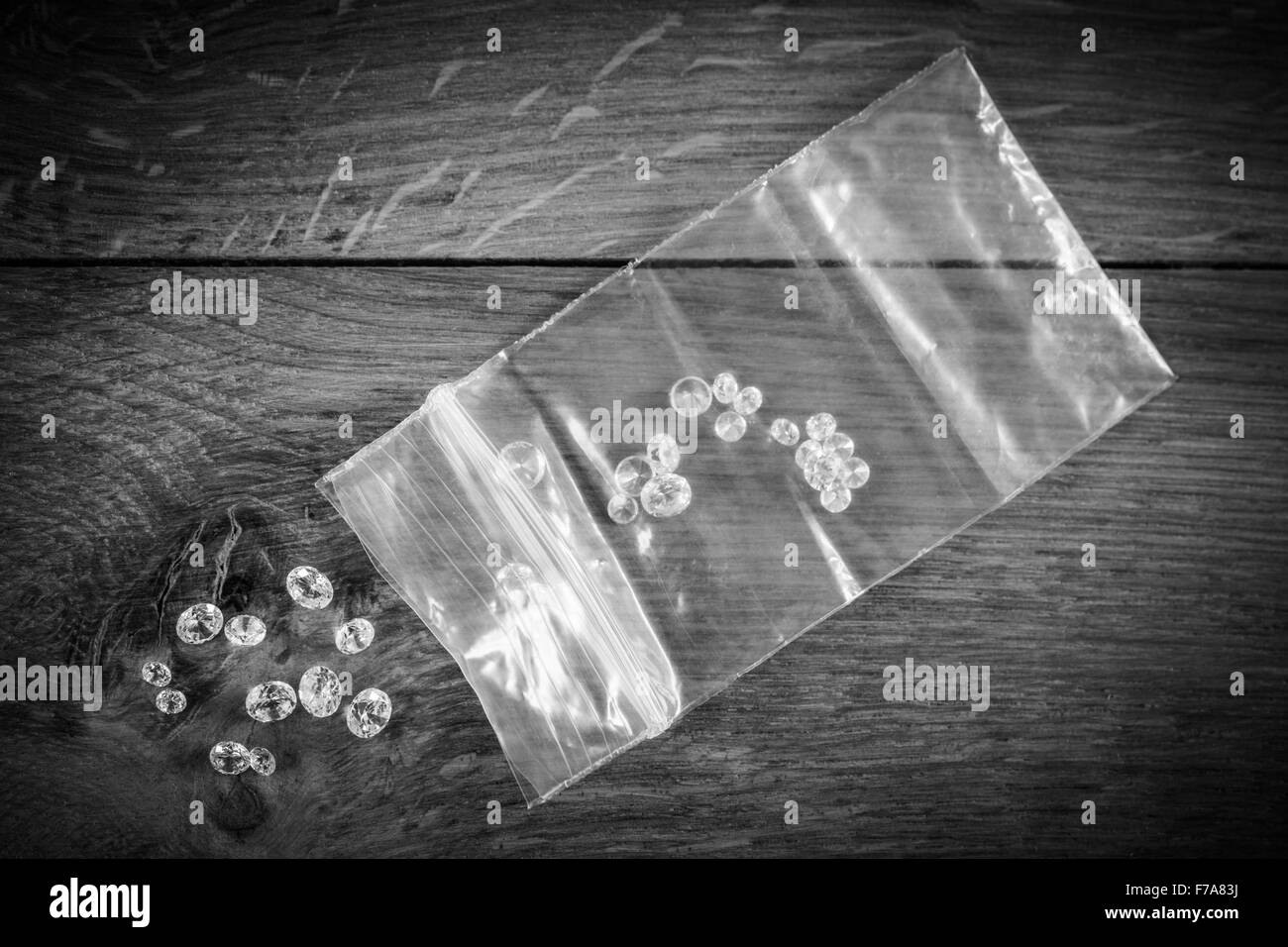 Diamonds spilling from a polythene bag Stock Photo - Alamy