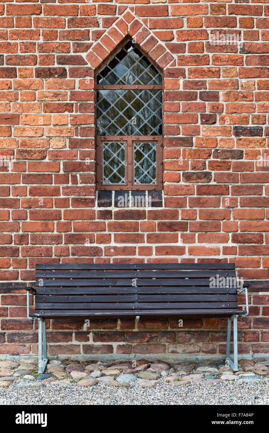Bench underneath a leaded church window. Closeup Stock Photo - Alamy