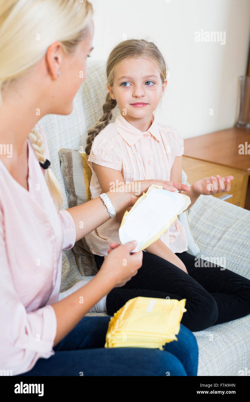 Mother and little girl having conversation about feminine hygiene Stock ...