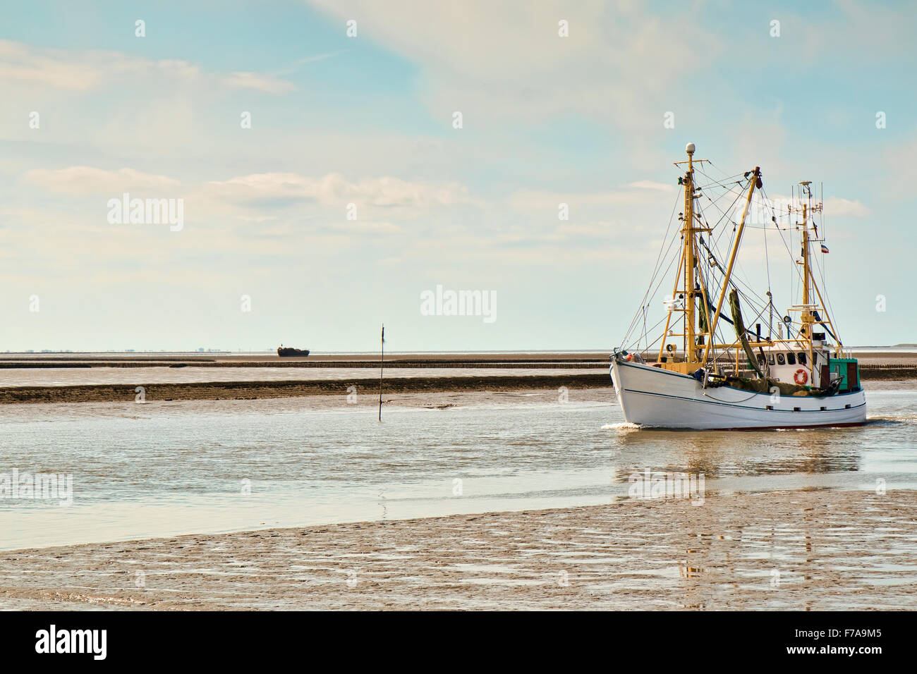 Fishing vessel entering the port at Husum, Germany Stock Photo - Alamy