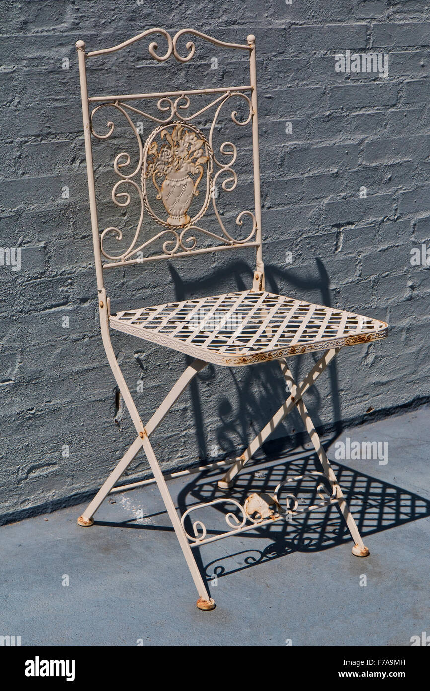 Closeup on an old rusty garden chair Stock Photo - Alamy