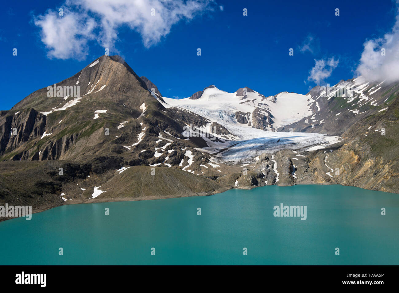Turquoise reservoir lake, Griessee, with Bättelmatthorn and ...