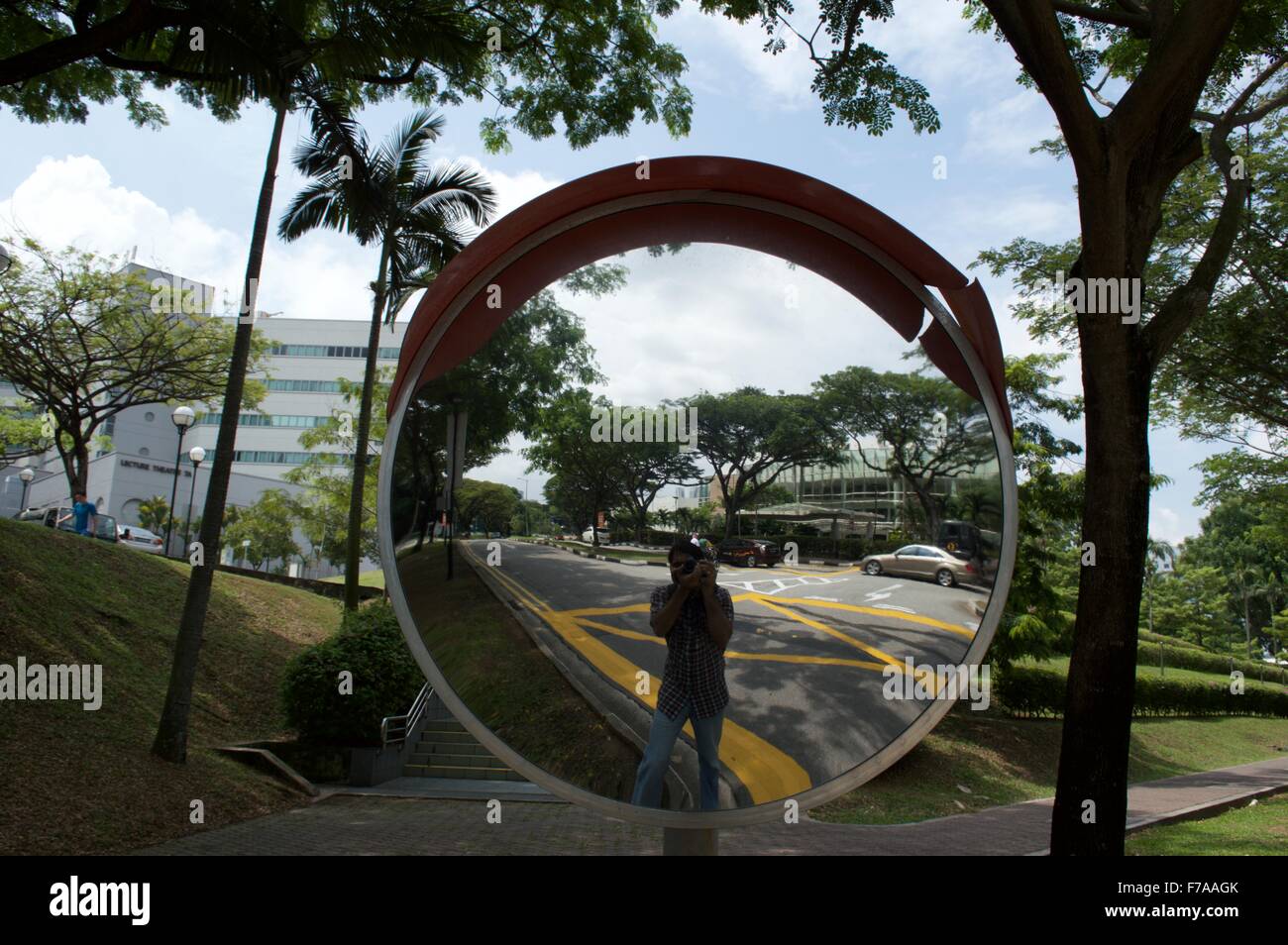 Traffic safety mirror on road side Stock Photo - Alamy