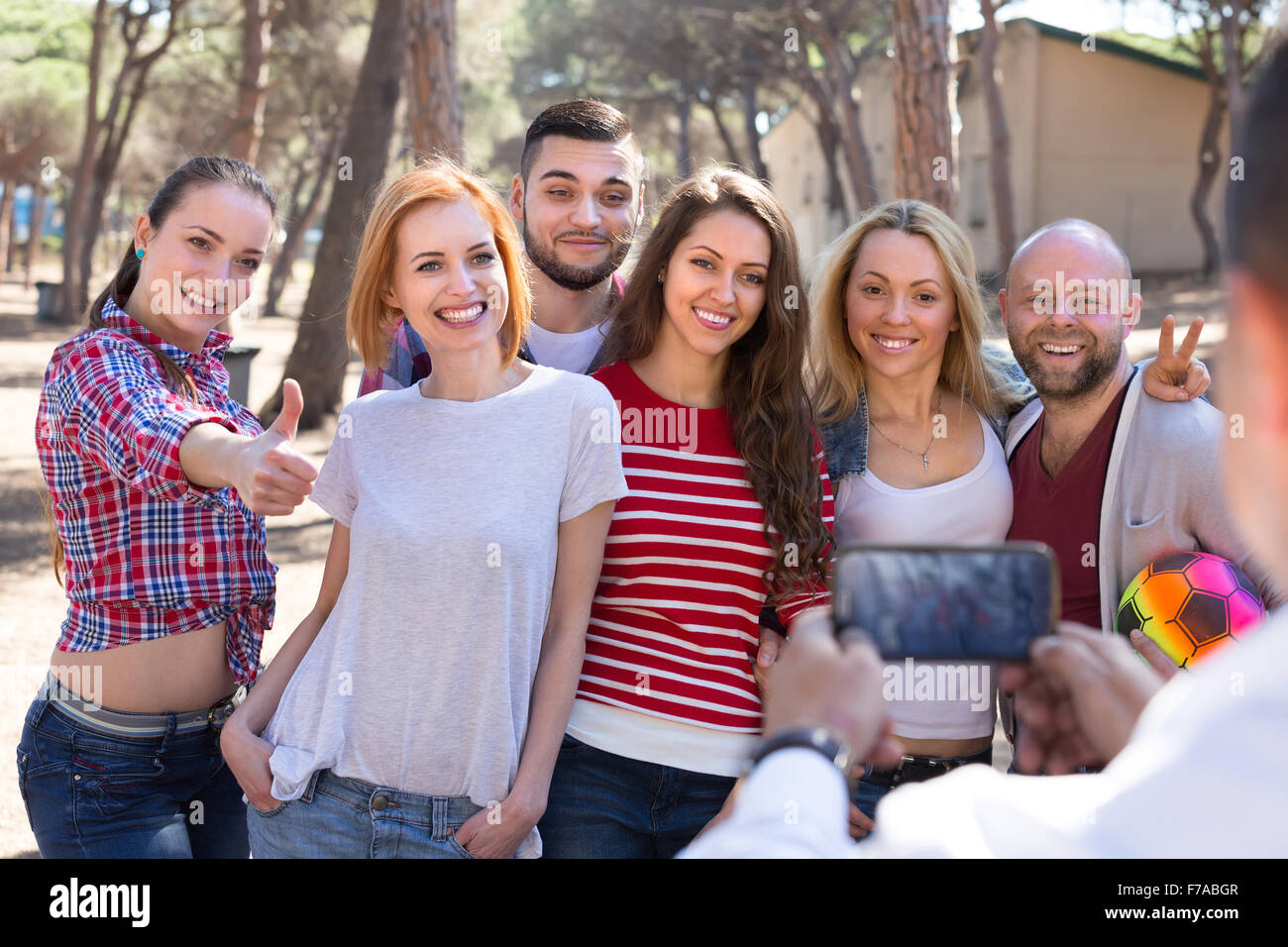 Happy adults relaxing outdoors and doing selfie Stock Photo - Alamy