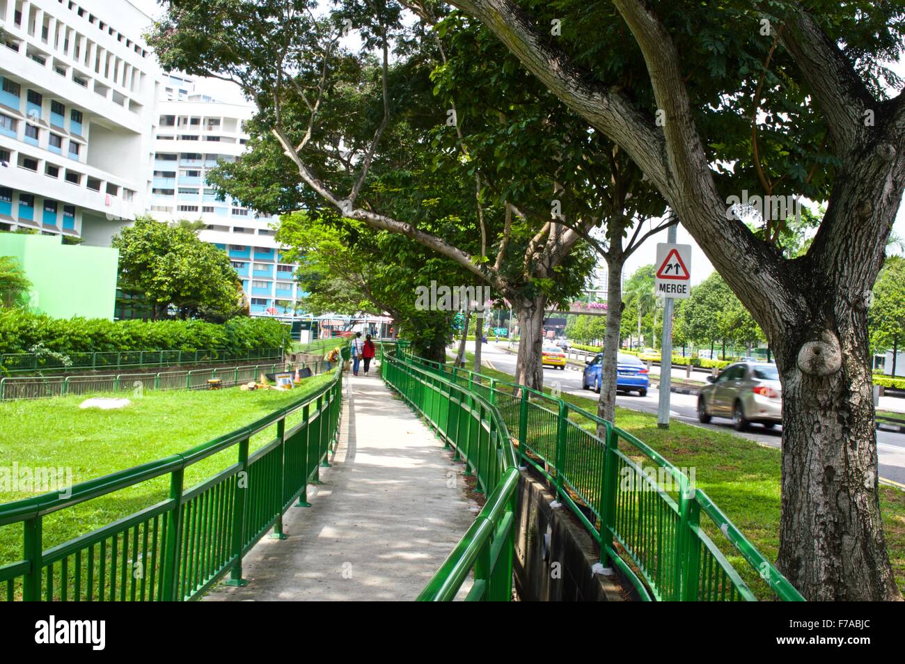 A pedestrian street with greenery covered Stock Photo - Alamy
