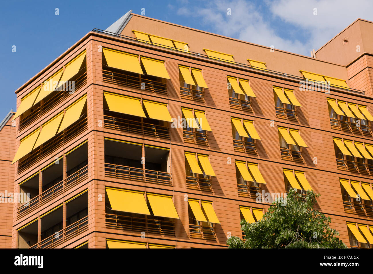 Modern apartment buildings in Berlin with yellow window shutters Stock ...