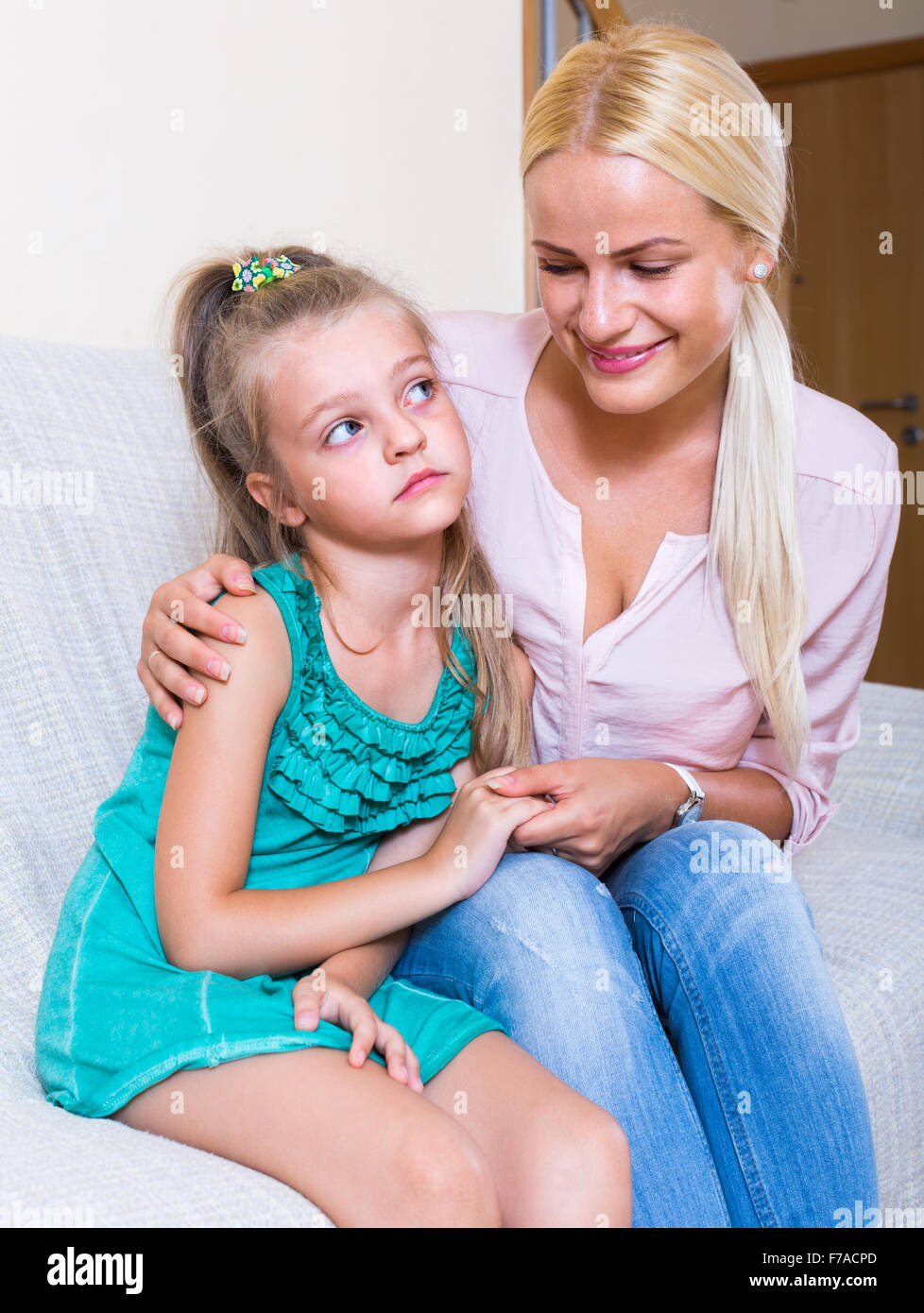 Home portrait of soft character woman and uhappy child Stock Photo - Alamy