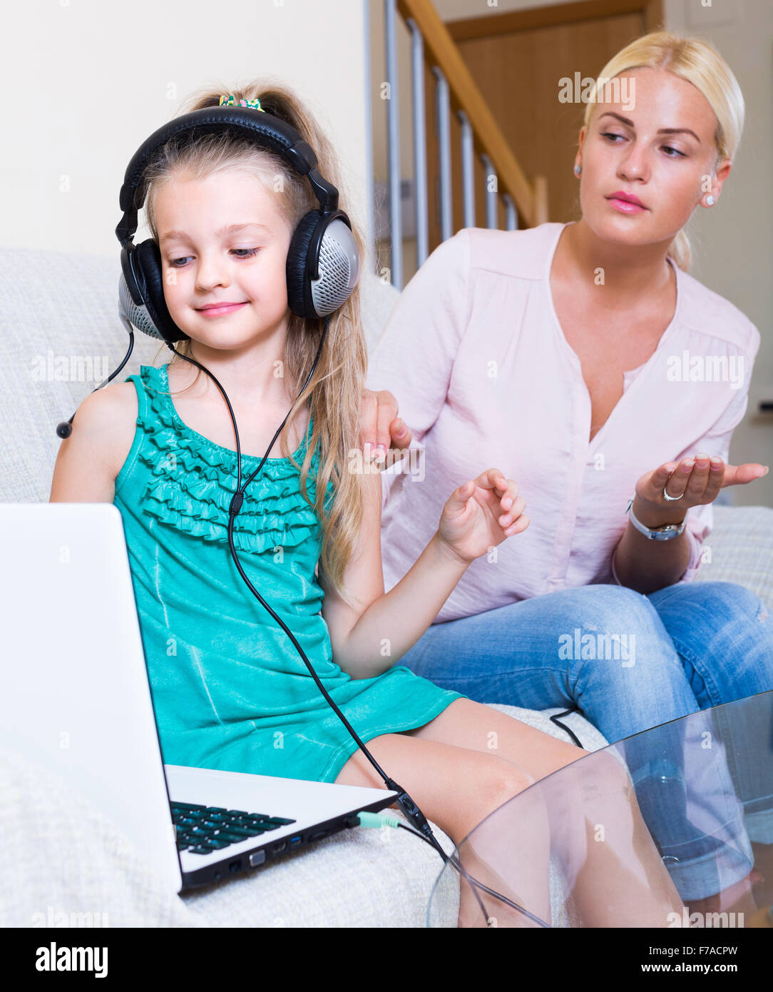 Mother displeased her little daughter playing too much games on ...