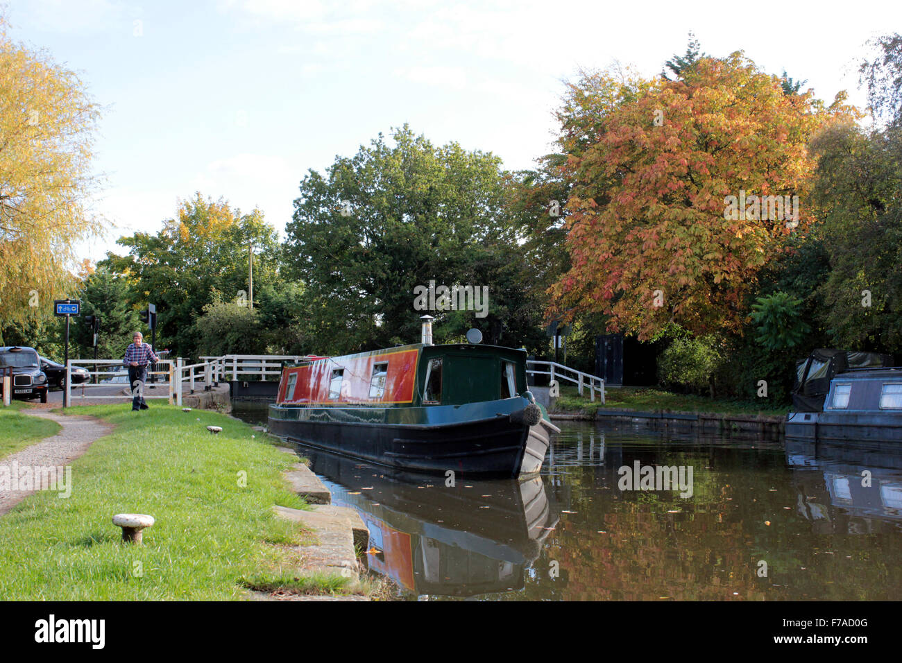 A canal boat is moored after passing through a swing bridge on the ...