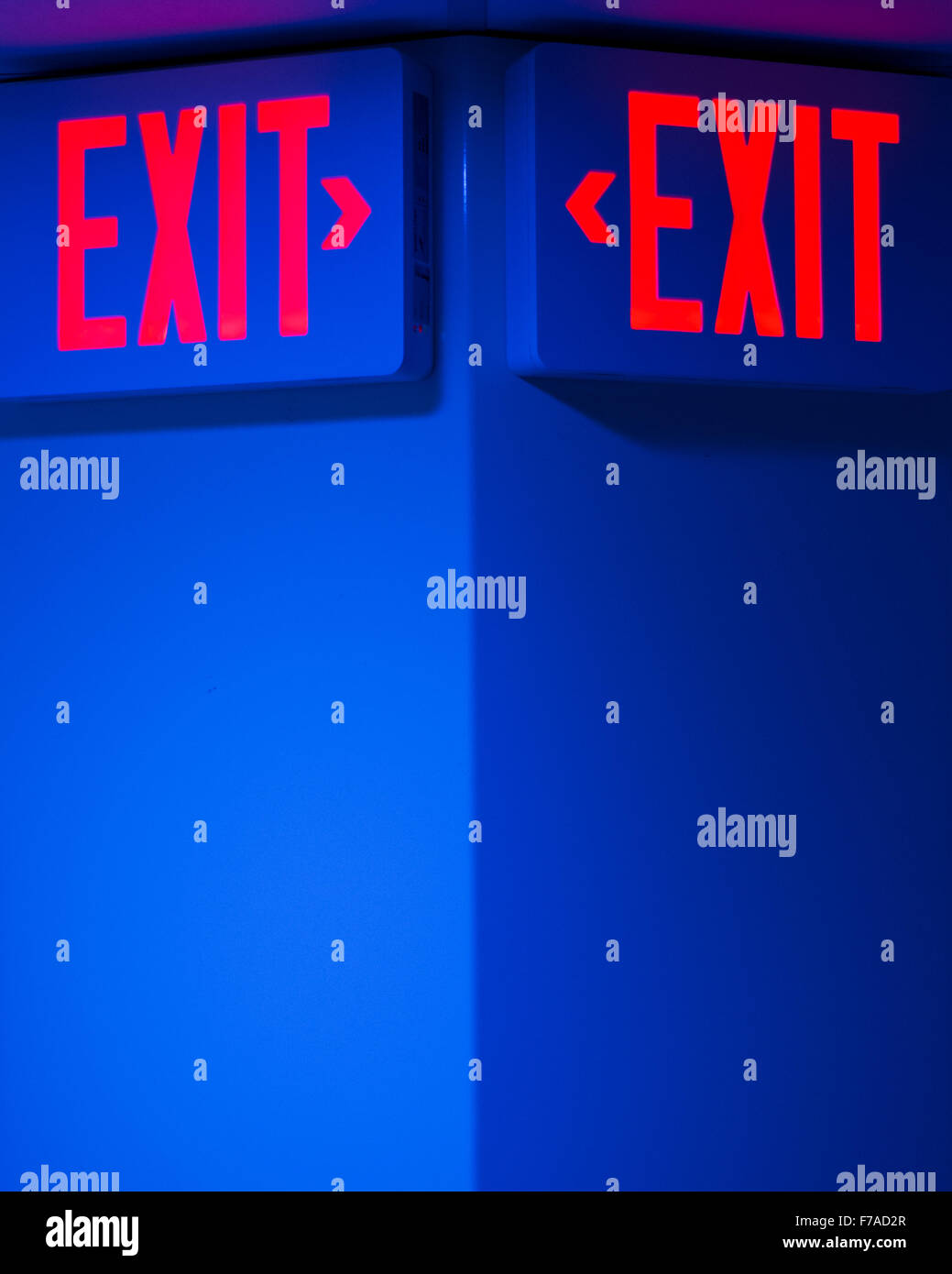 Two exit signs appear to cancel each other out Stock Photo - Alamy