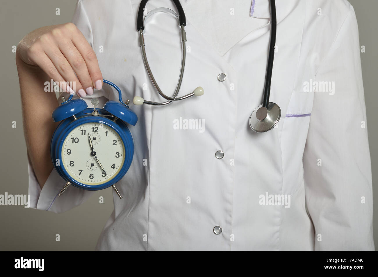 doctor with clock Stock Photo - Alamy