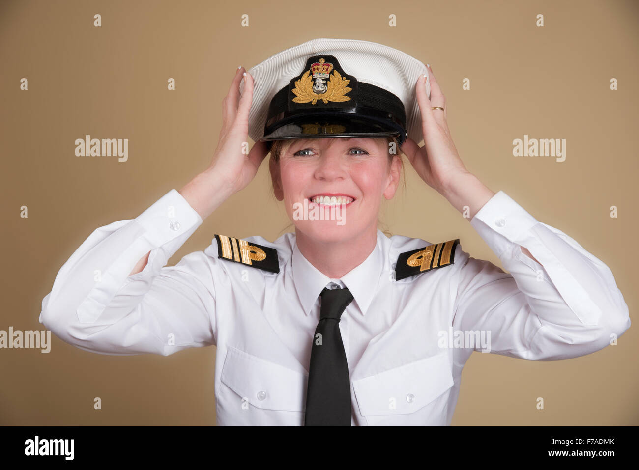 Portrait of a female senior rank of Lt Commander naval officer holding ...