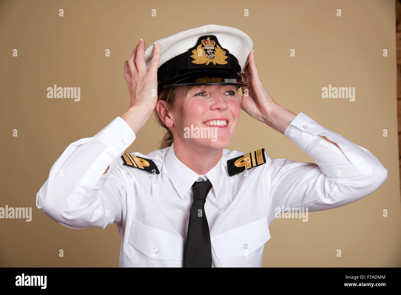 Portrait of a female senior rank of Lt Commander naval officer holding ...