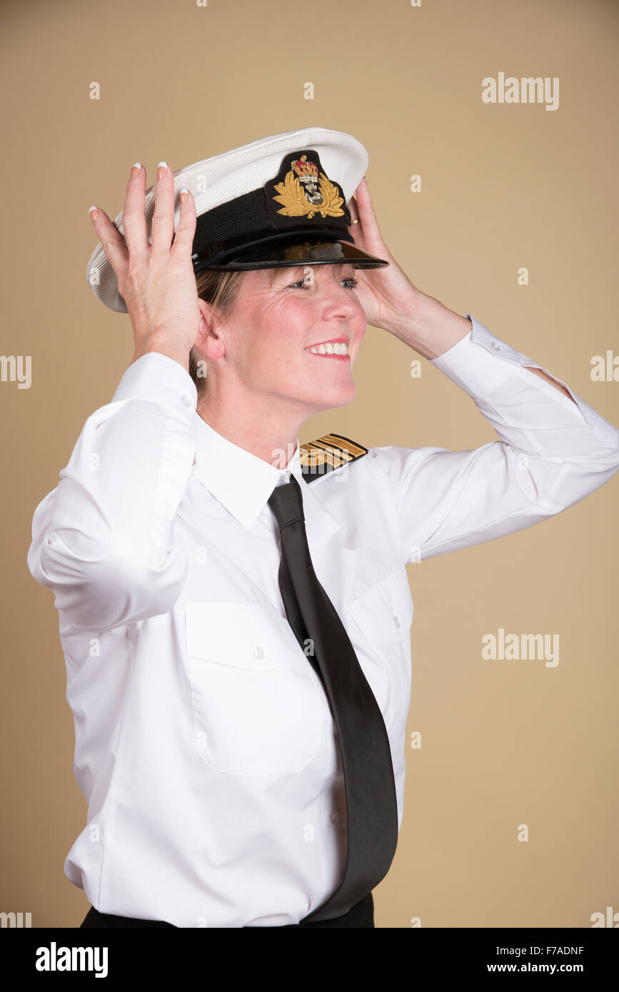 Portrait of a female senior rank of Lt Commander naval officer holding ...