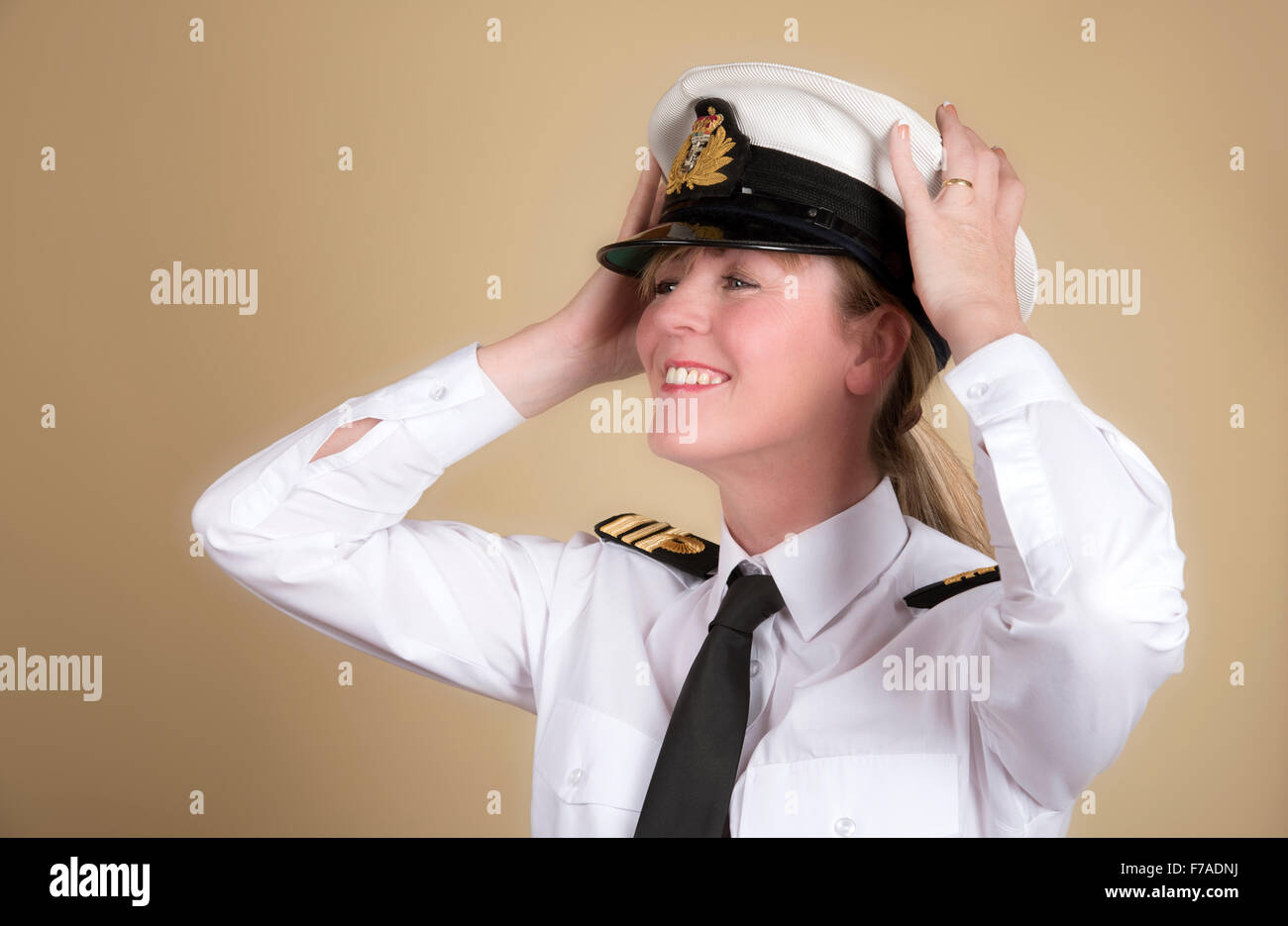 Portrait of a female senior rank of Lt Commander naval officer holding ...