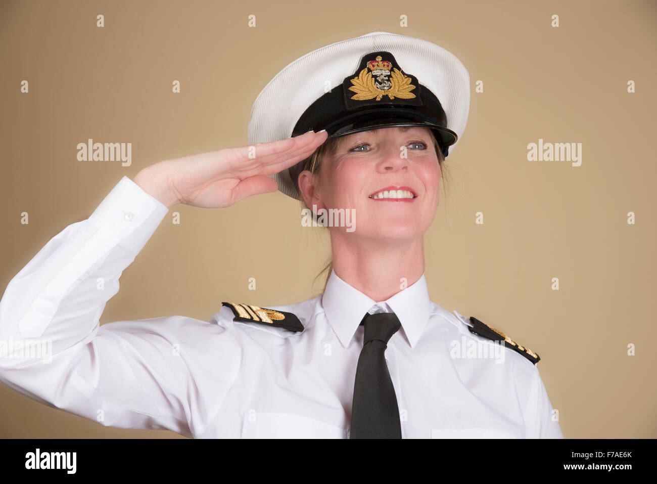 Female navy officer in uniform of a Lt Commander wearing a hat and ...