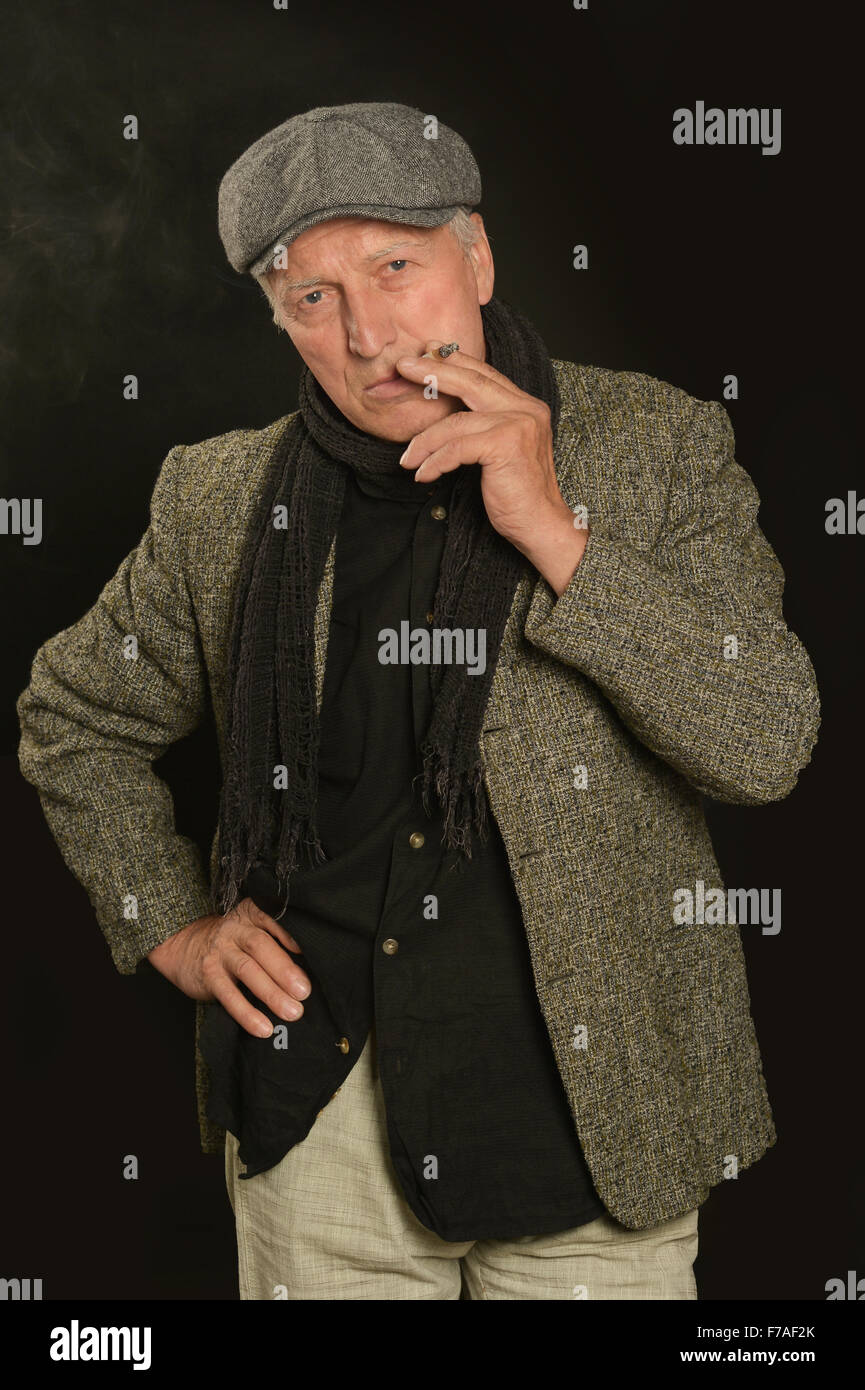 Senior man smoking Stock Photo - Alamy
