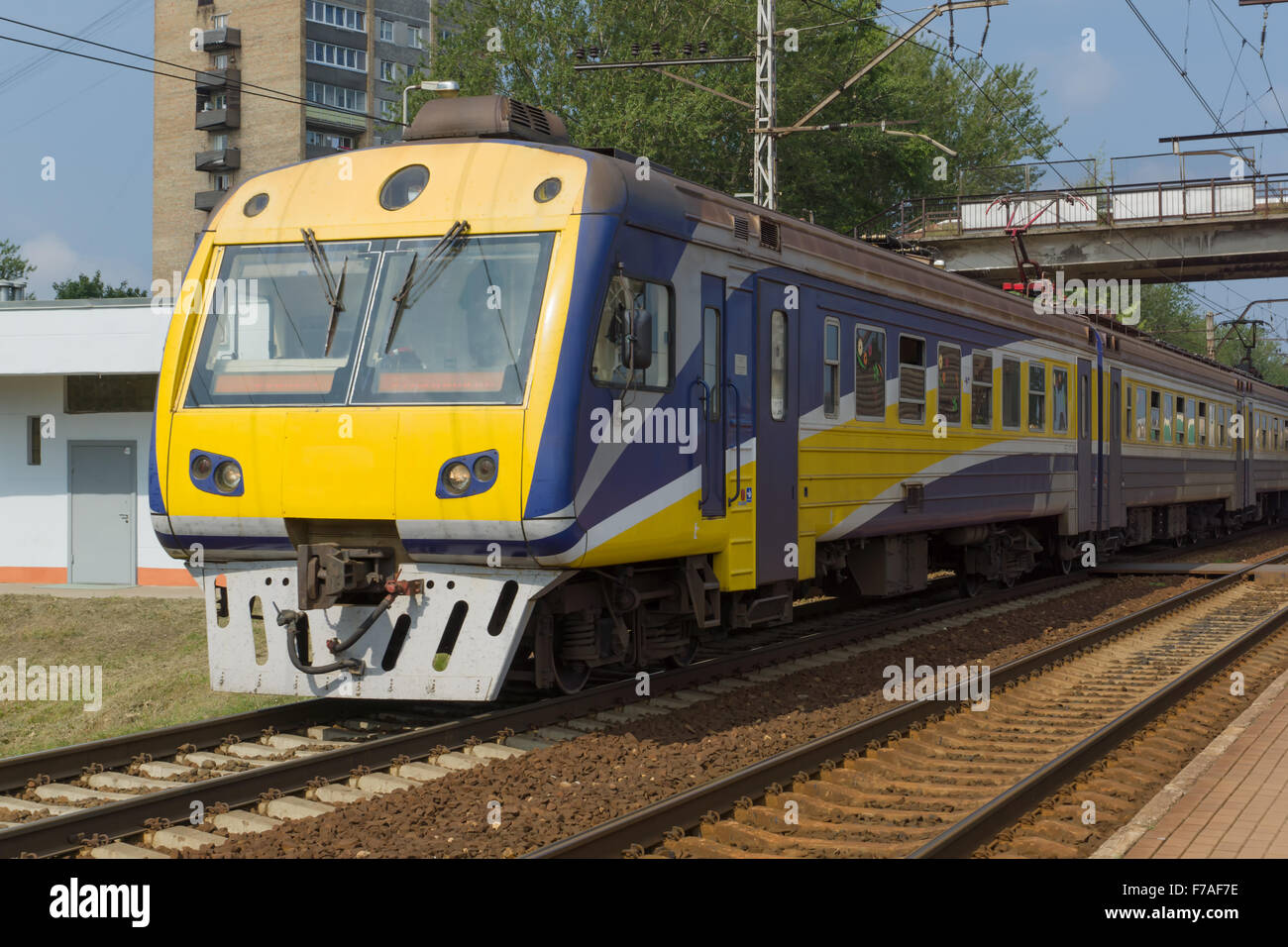 the train of yellow and blue color costs on railway tracks Stock Photo ...