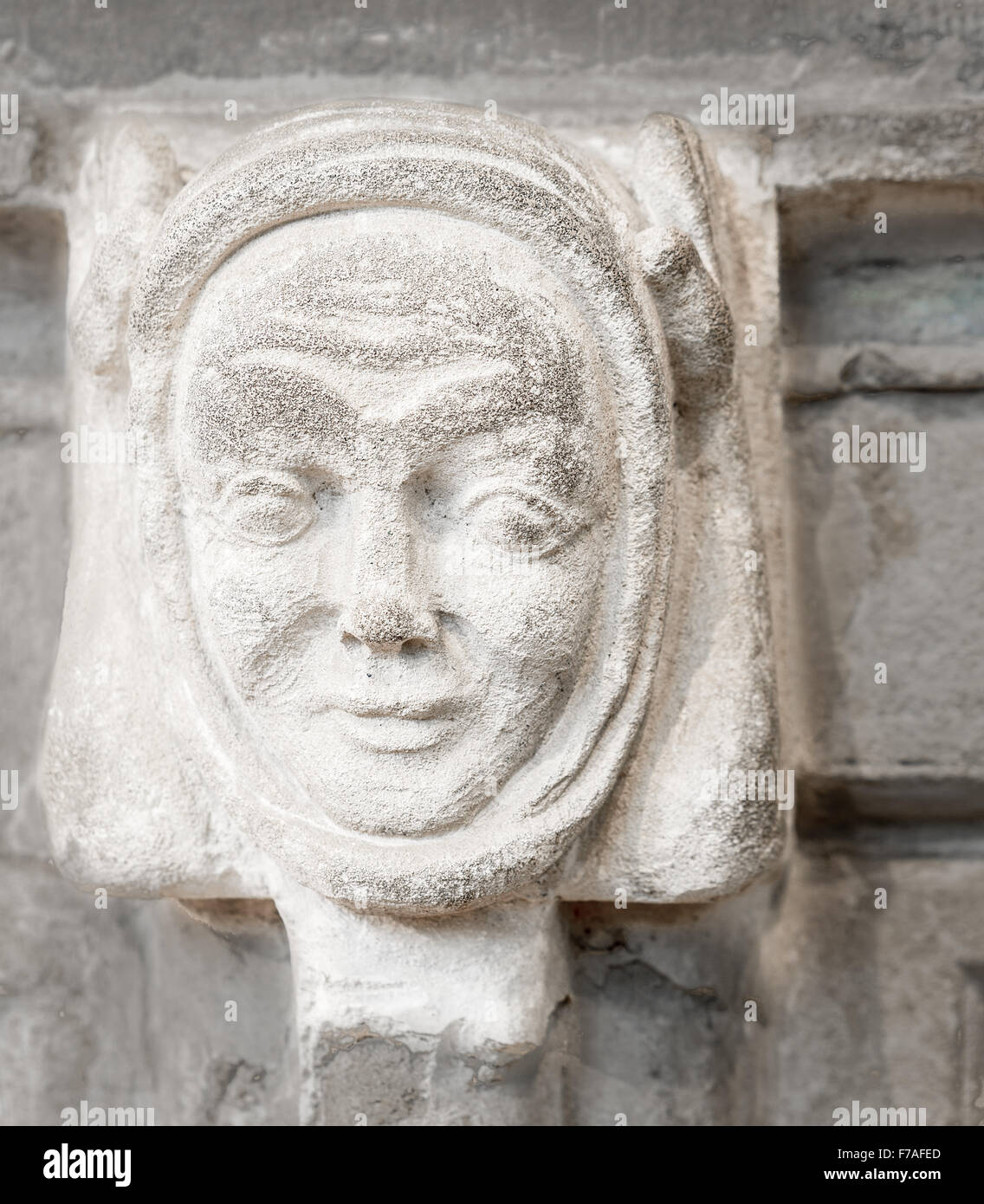 Weathered stone bust at the medieval church of St Mary the Virgin, dating from the thirteenth ...