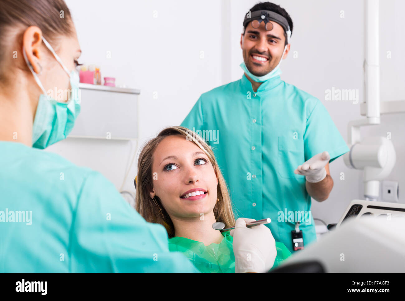 Portrait of doctor and positive russian patient at dental clinic Stock ...