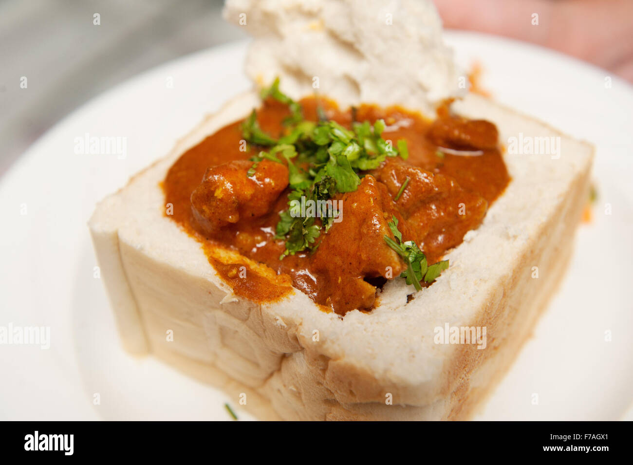 A traditional South African bunny chow, Indian curry served in a ...
