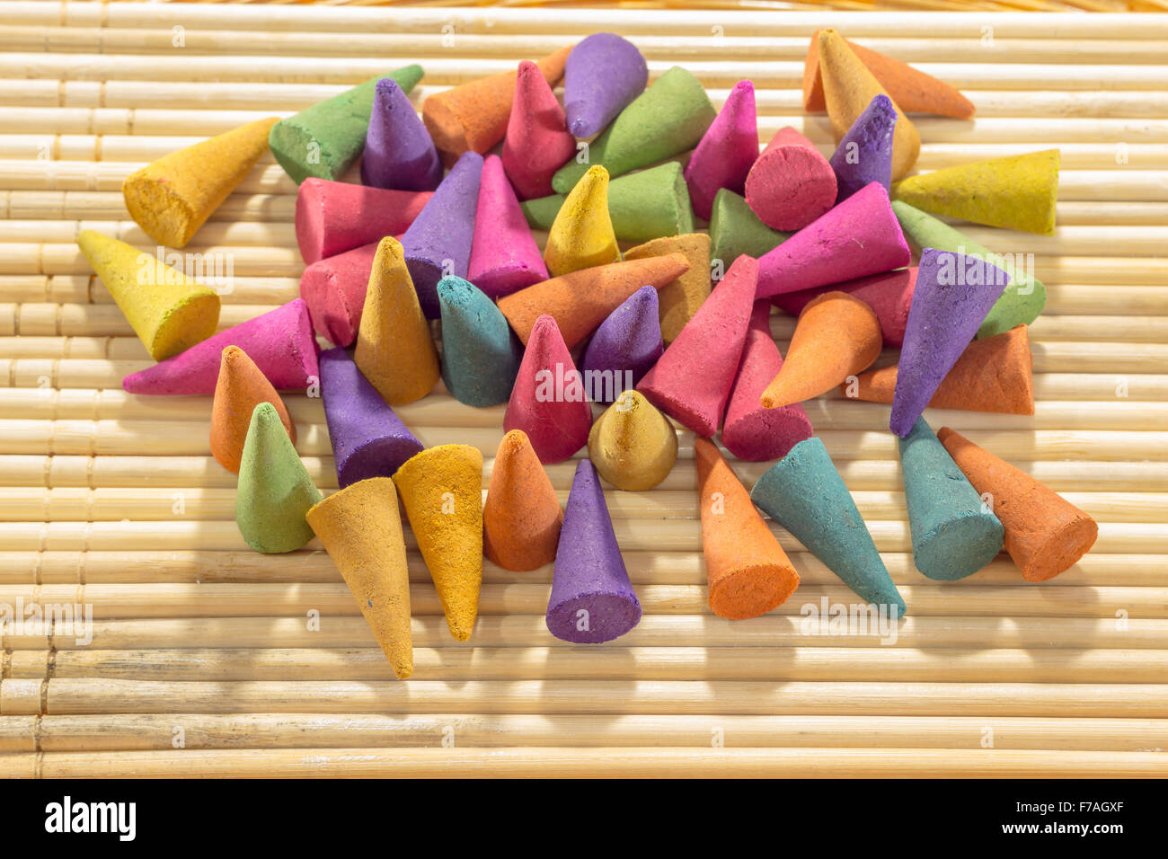 Colorful incense cones with wooden background Stock Photo - Alamy