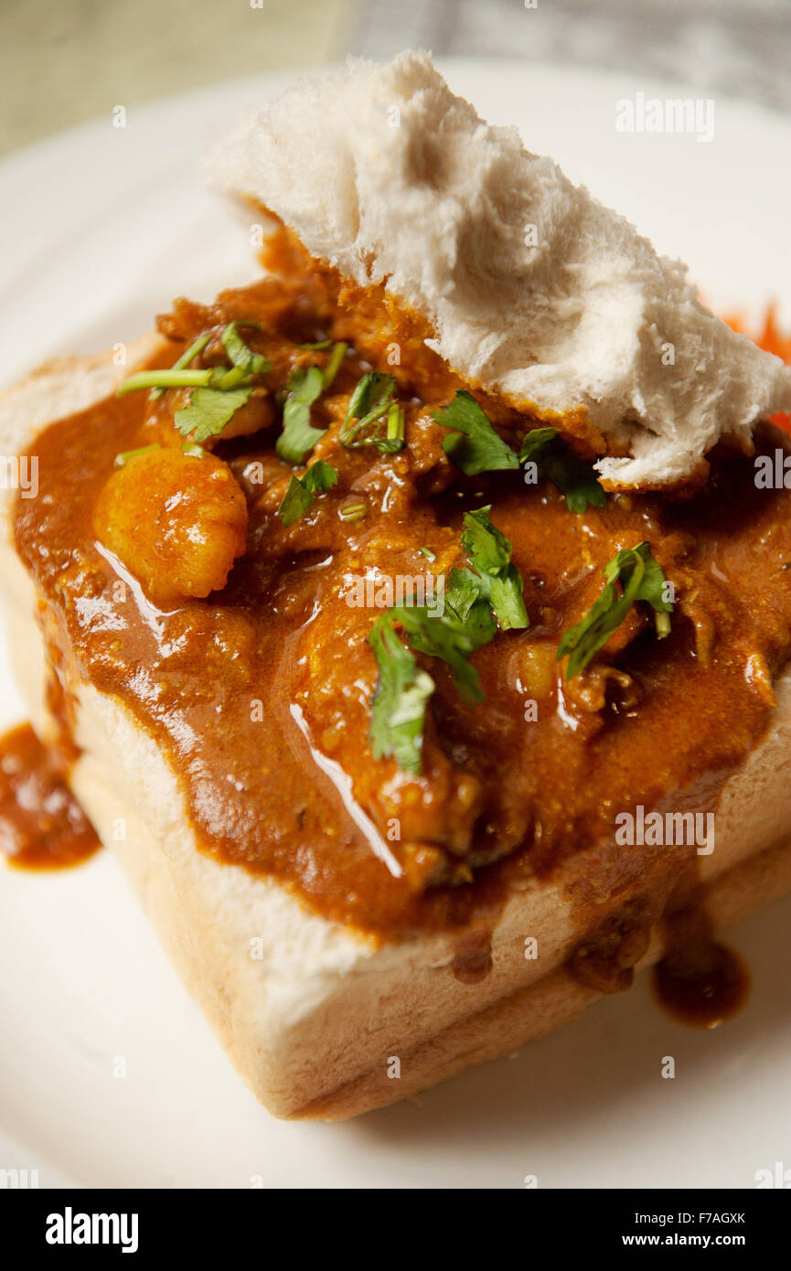 A traditional South African bunny chow, Indian curry served in a ...
