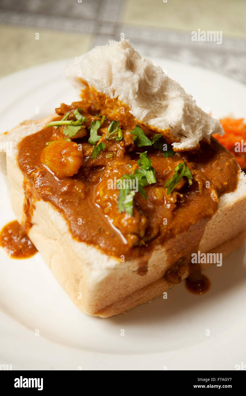 A traditional South African bunny chow, Indian curry served in a ...