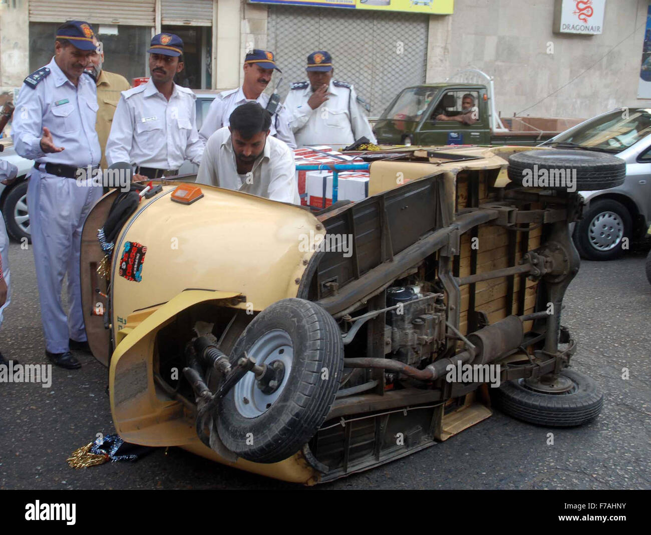 An overloaded auto rickshaw strayed off due to over speeding near ...
