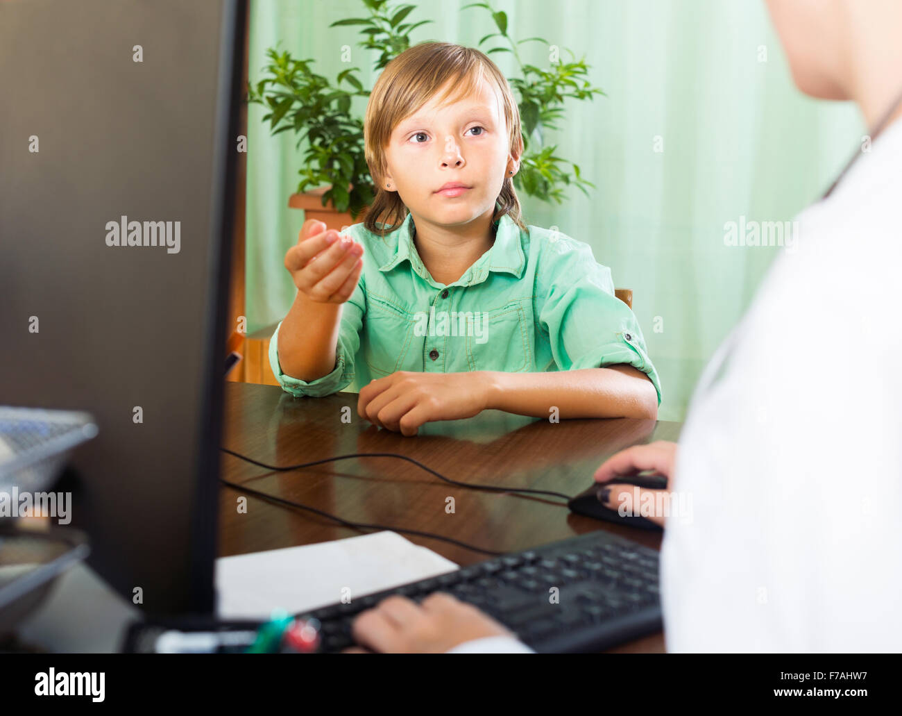 Boy patient in the medical center at the doctor Stock Photo - Alamy