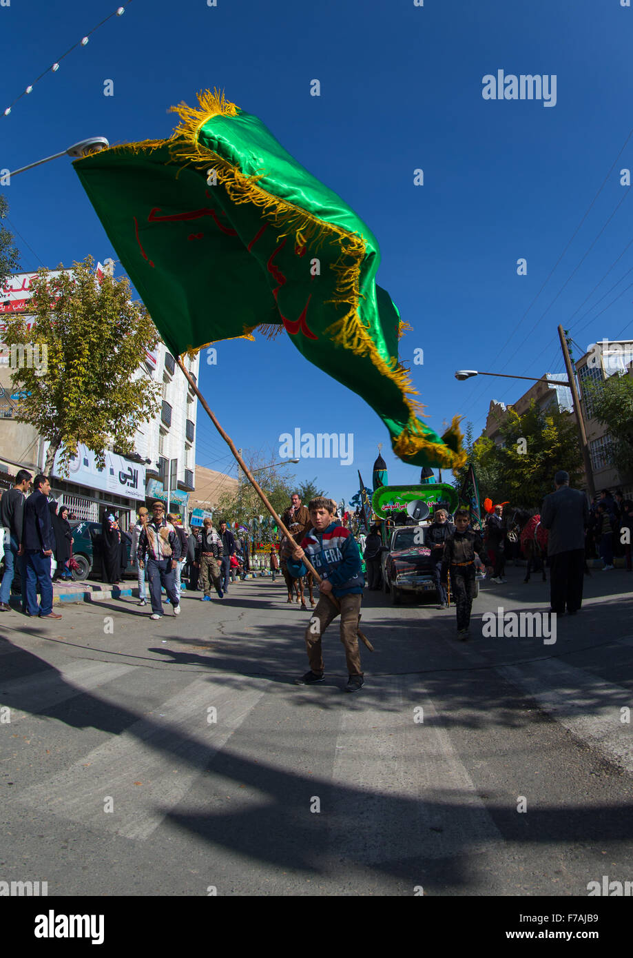 Iranian Shiite Muslim Boy Waving A Giant Green Flag During Ashura, The ...