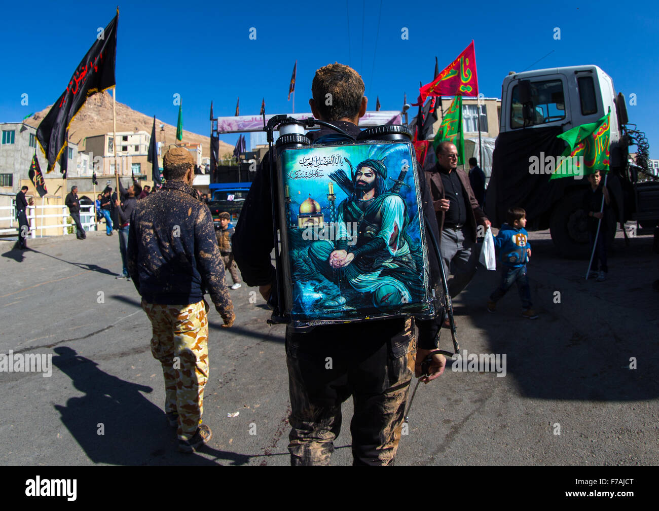 Iranian Shiite Muslim Man Carrying A Tank Of Rose Water With Iman ...