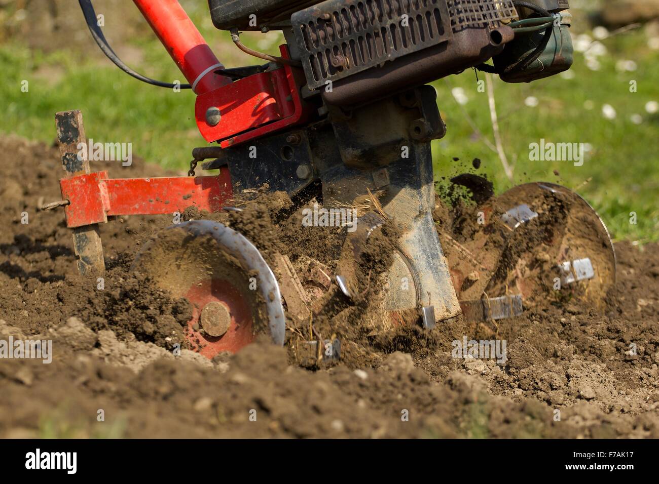 Closeup of hand motor plow blade throwing clay Stock Photo - Alamy