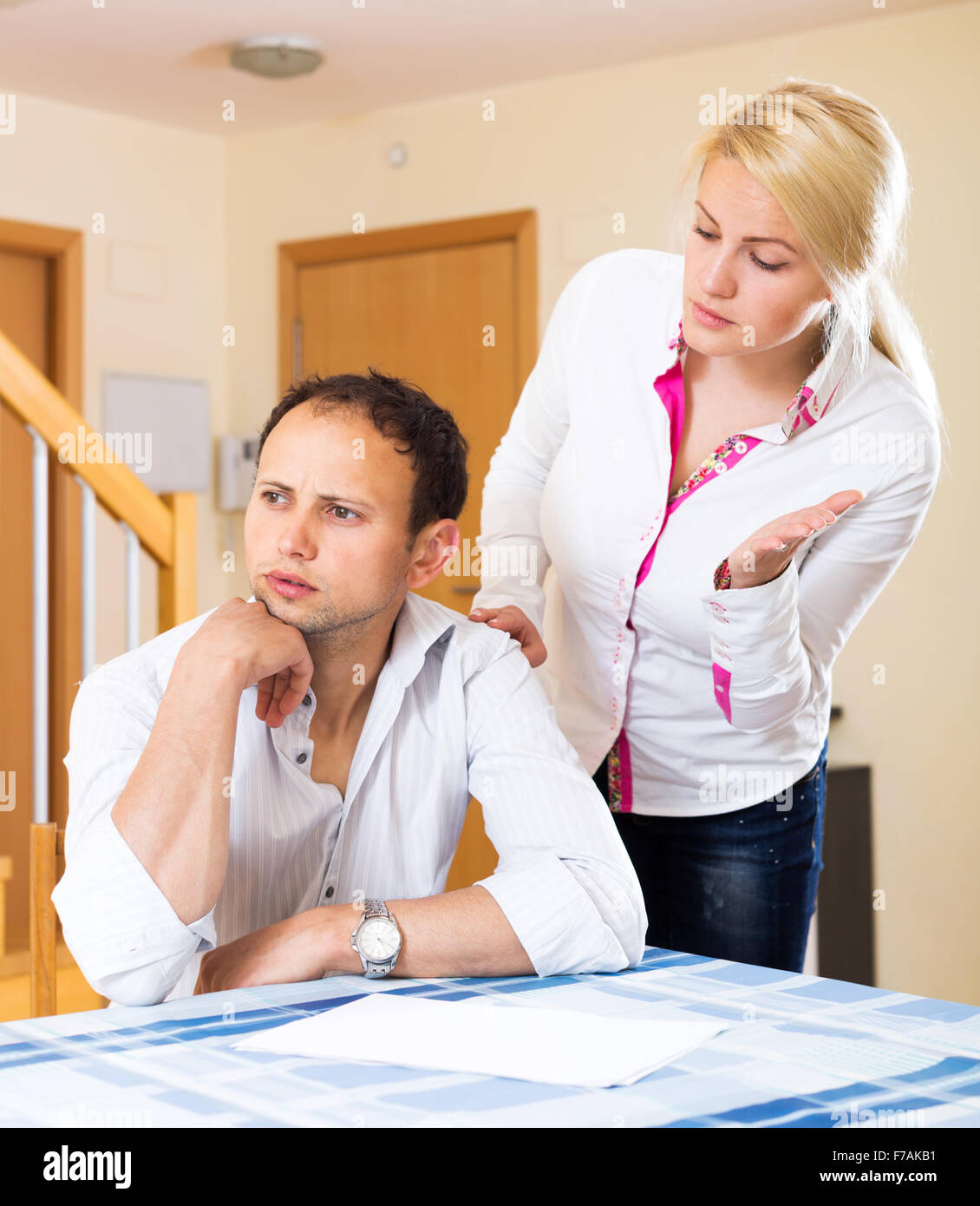 Family quarrel.Young couple having problems at home. Focus on the man ...