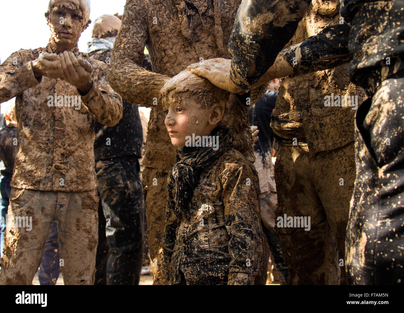 Iranian Shiite Muslim Boy Covered In Mud By Adults During Ashura Day ...