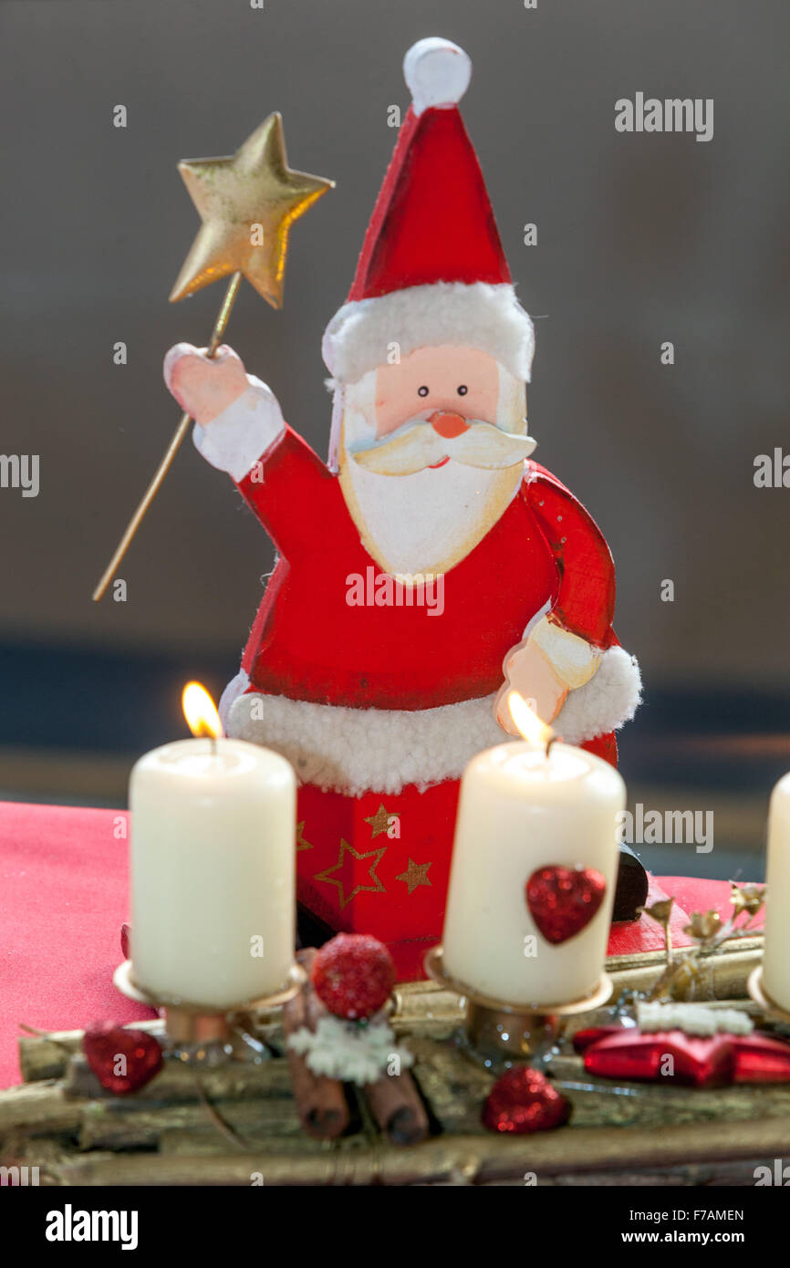 Santa Claus decoration, burning candle Stock Photo - Alamy