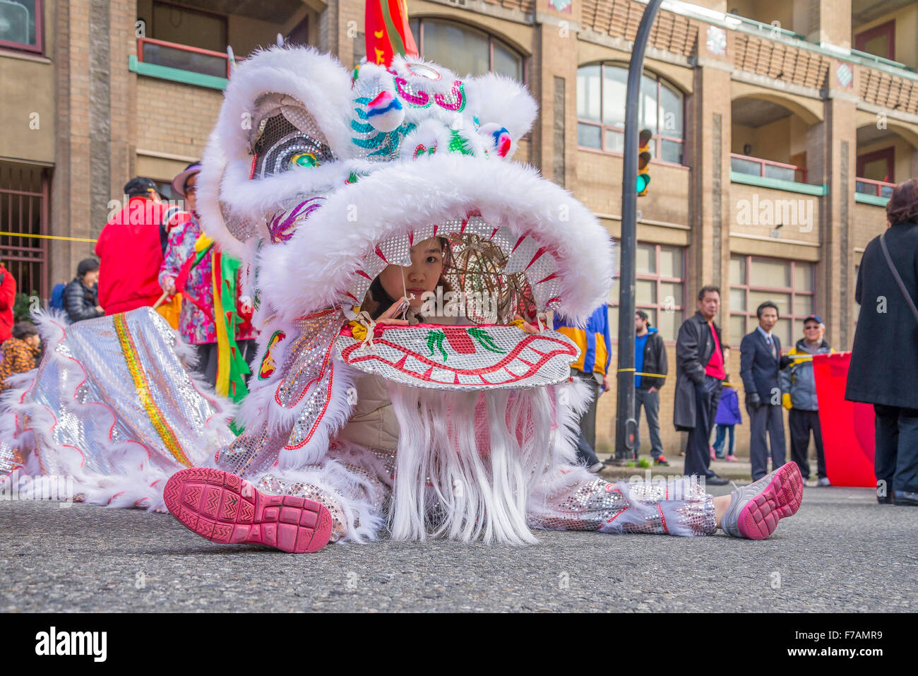 Lion dancer at rest, Chinese New Year Parade Stock Photo - Alamy